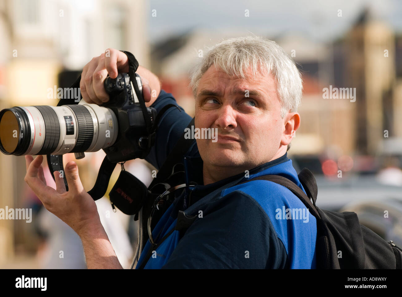 A photographer looking for inspiration Stock Photo - Alamy