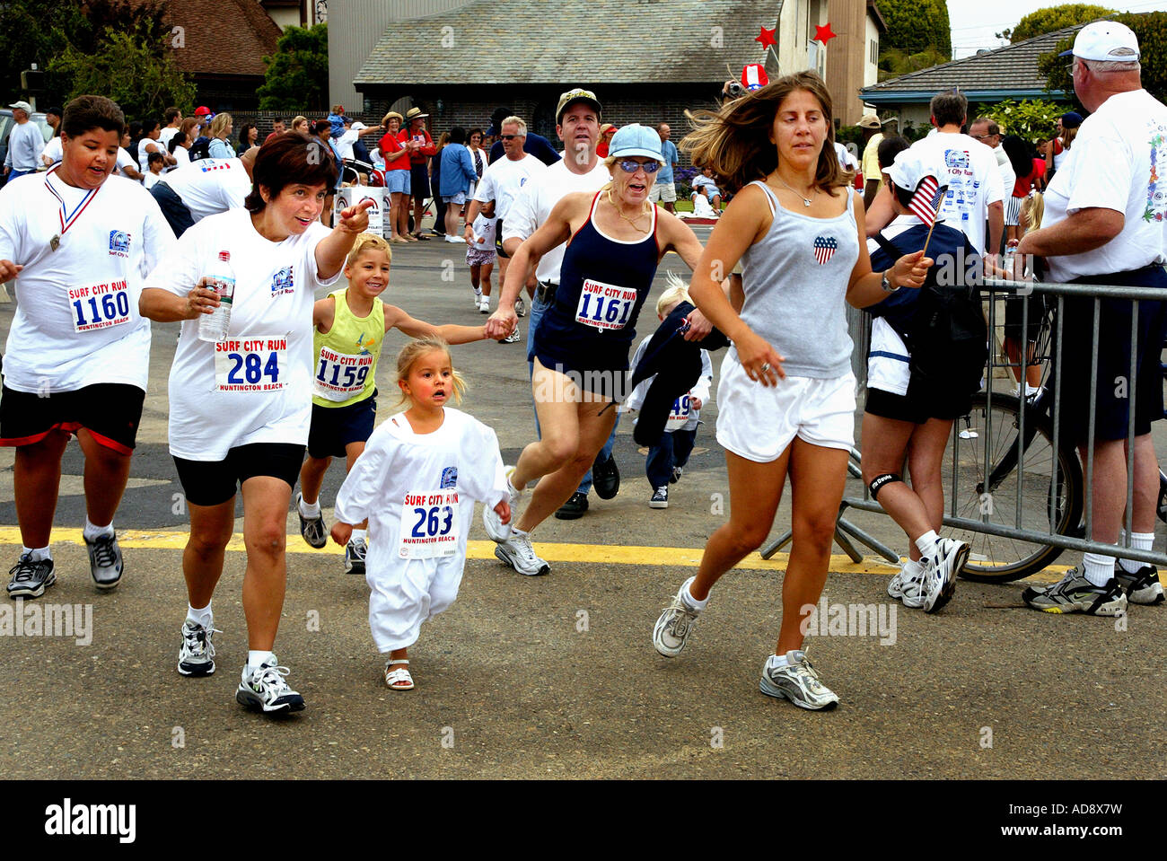 Parents and children run together in 5K race before start of 4th of ...