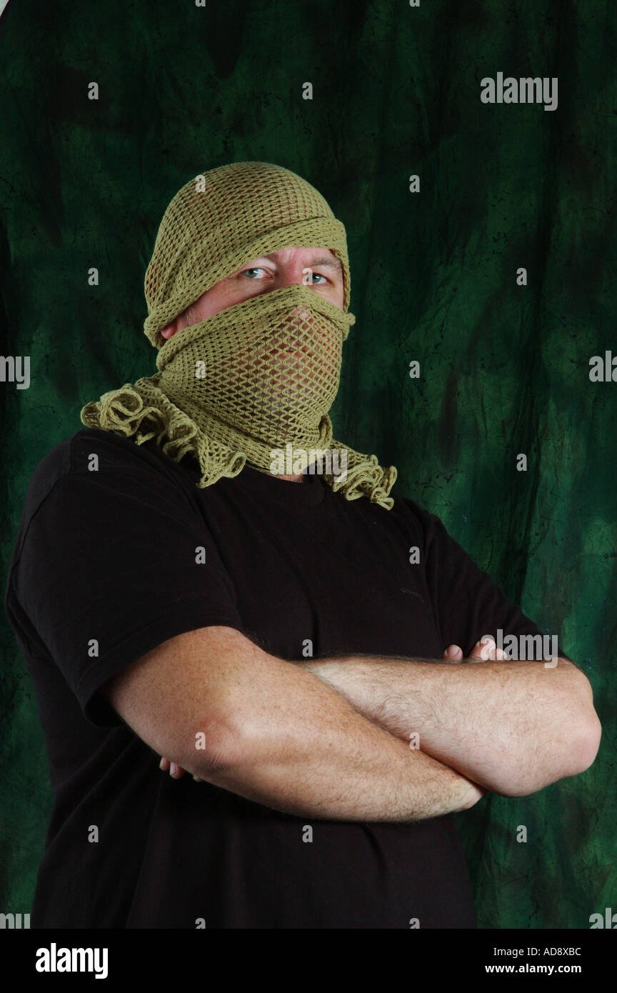 hidden identity scrim and folded arms dsca 4260 Stock Photo - Alamy