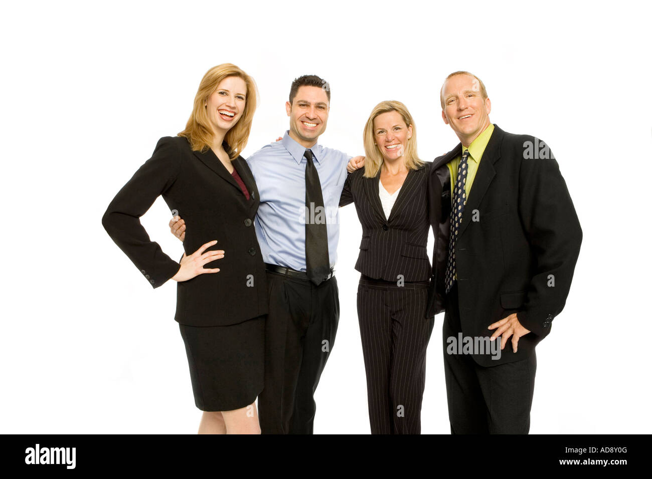 Four business people stand together Stock Photo - Alamy