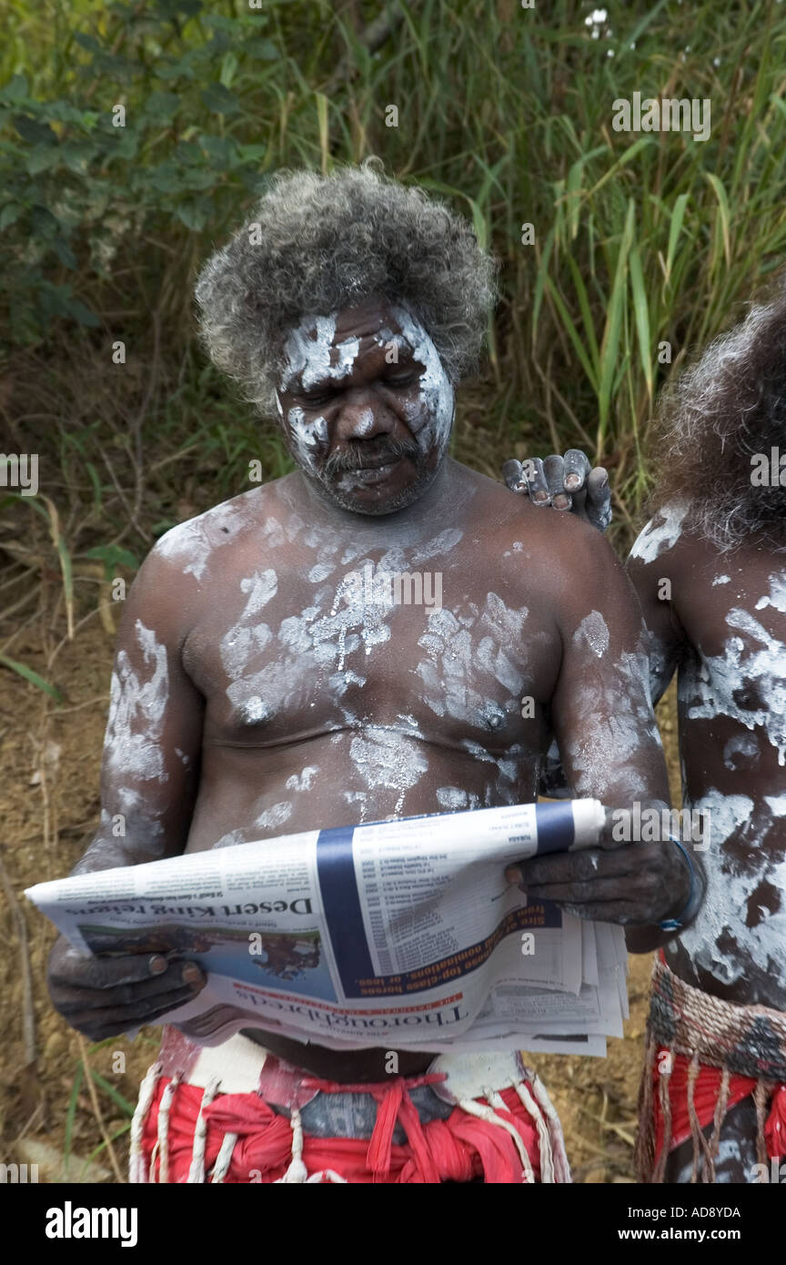 Aboriginal dancer reading newspaper at first persons festival ...