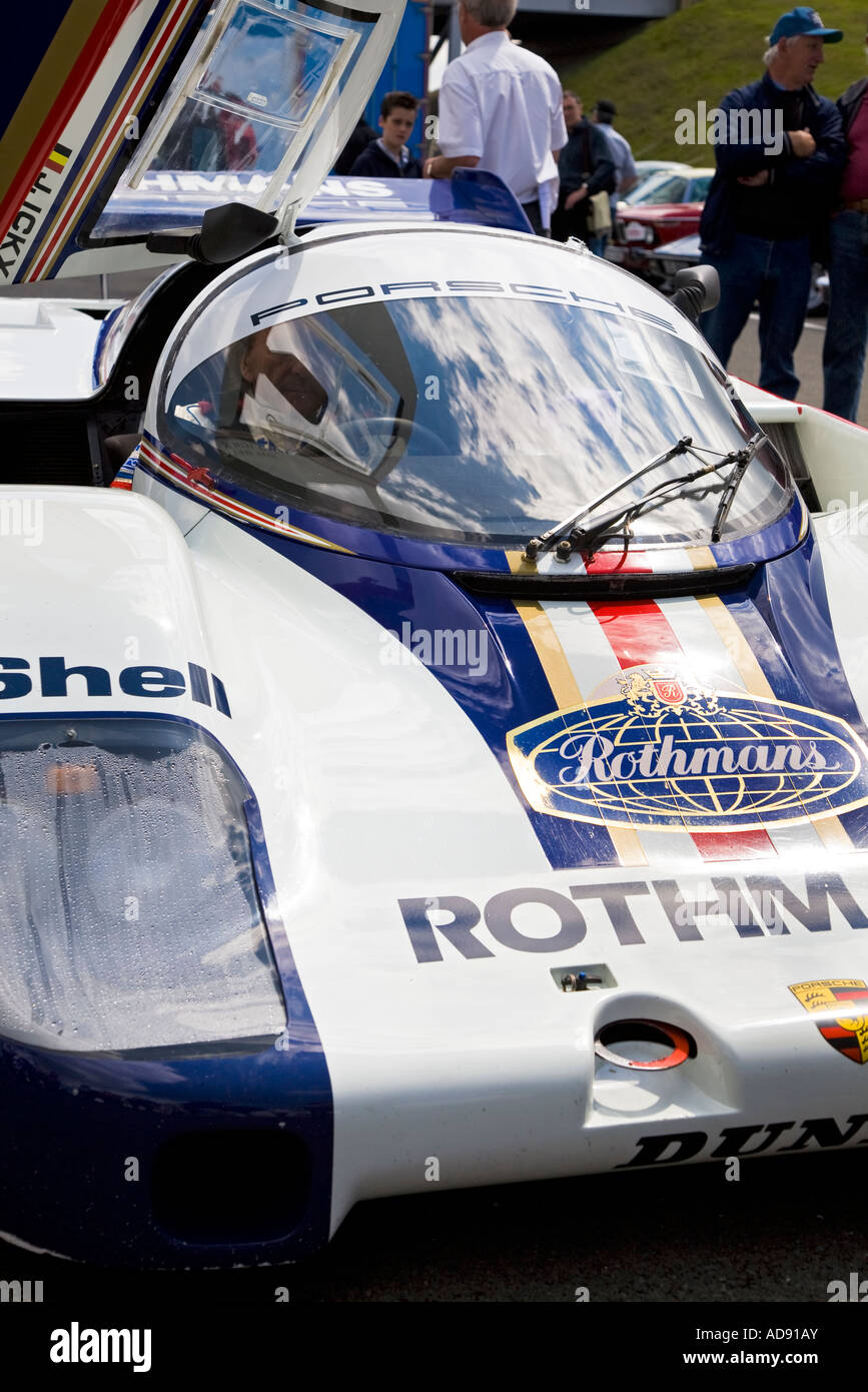 Derek Bell waiting to display a classic Rothmans 956 Porsche race ...