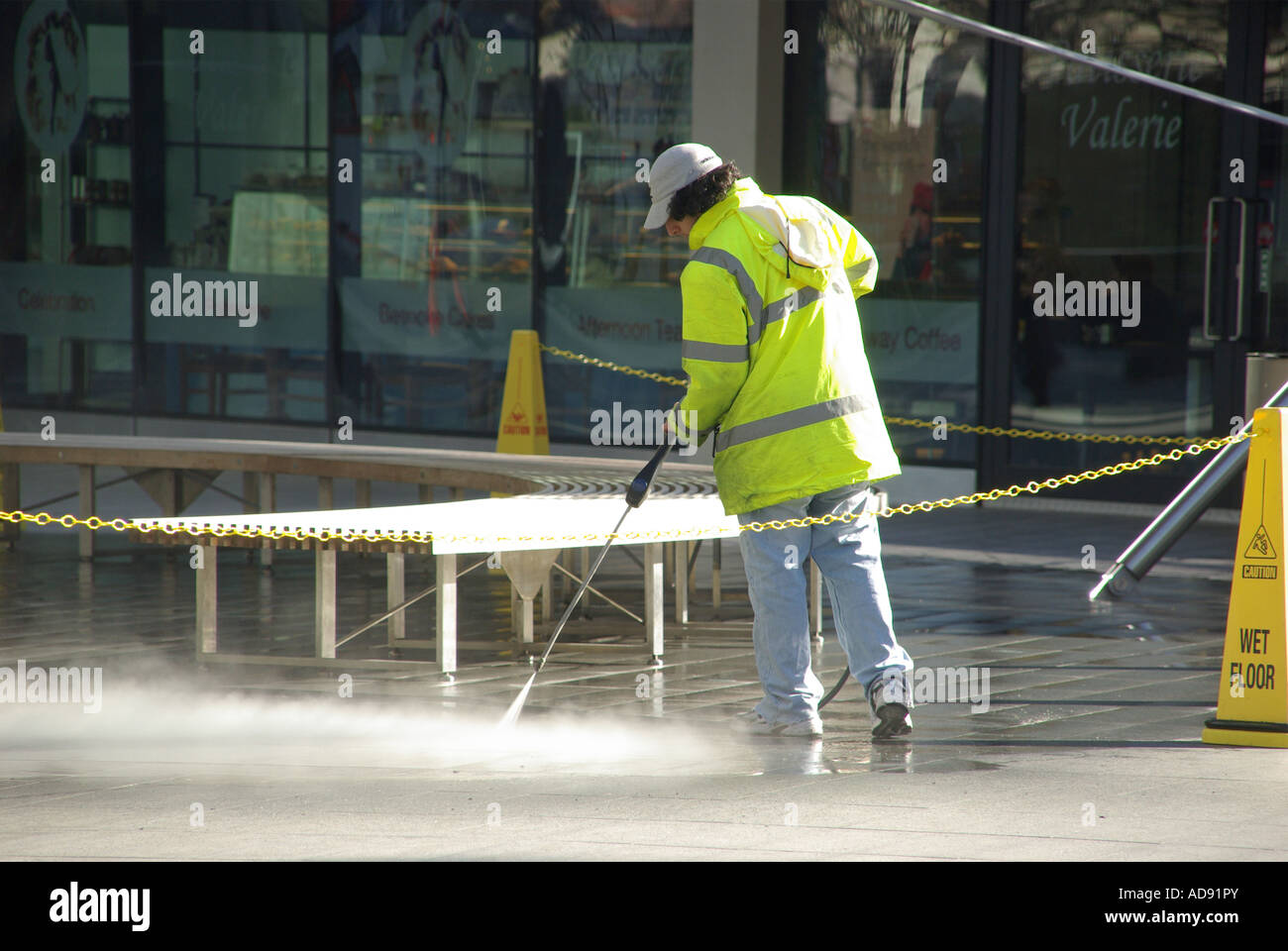 High pressure washer machine water spray jet cleaning paving of chewing ...