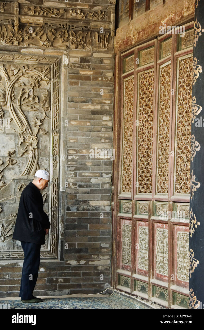 men praying at The Great Mosque located in the Muslim Quarter home to ...
