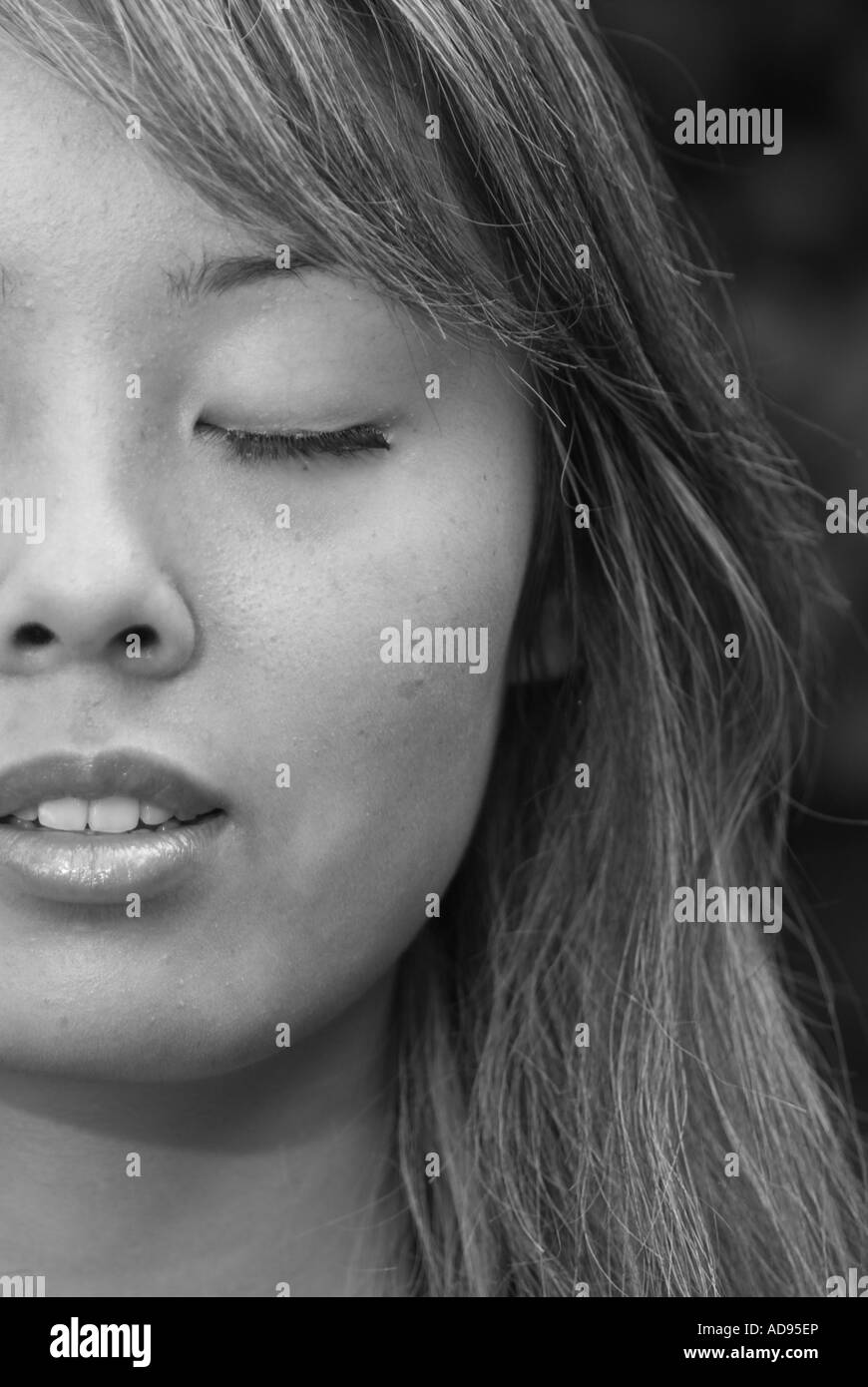 Headshot of a pretty young Asian woman Stock Photo - Alamy