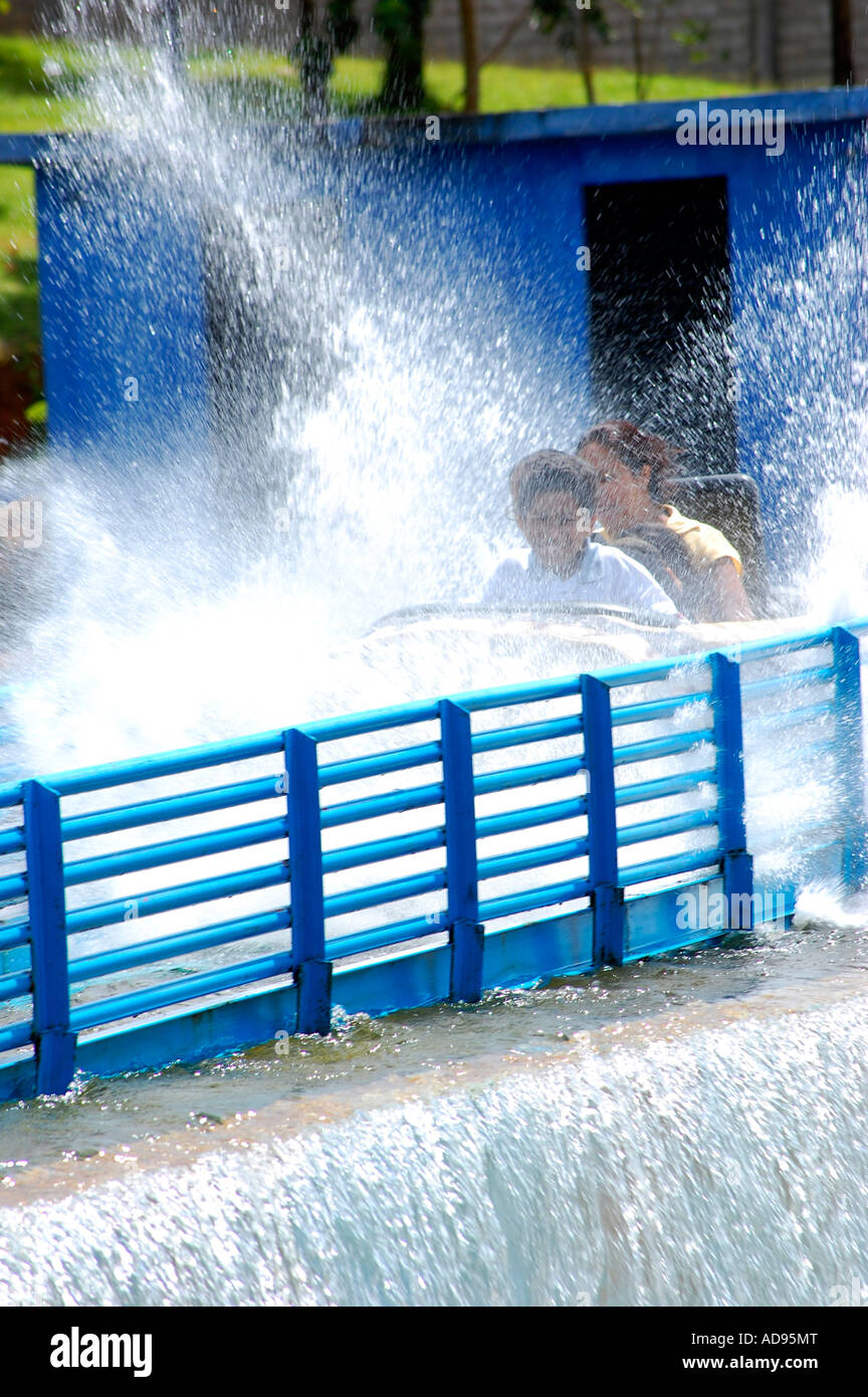 two people having fun while riding Log flume Stock Photo - Alamy
