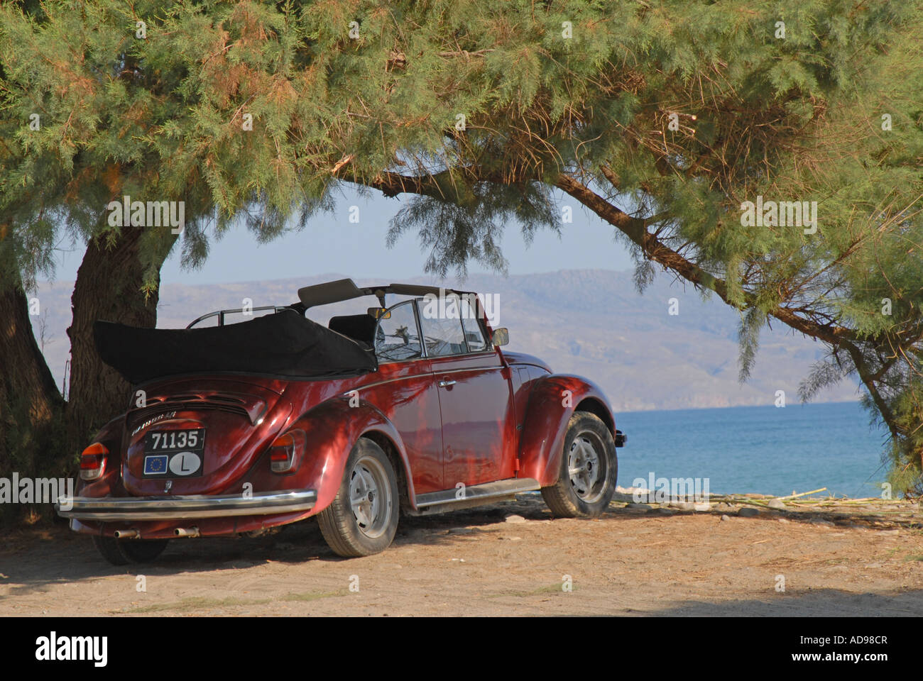 CRETE Car on the beach at Maleme near Hania on Crete's north-west coast ...