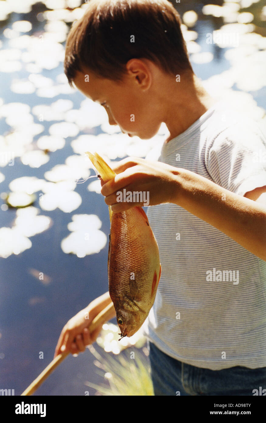 boy white fish Stock Photo - Alamy