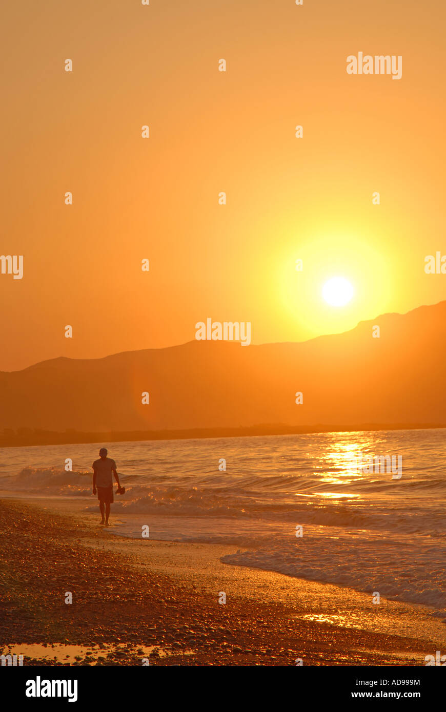 CRETE. Sunset over the Rodhopou Peninsula as seen from the beach ...