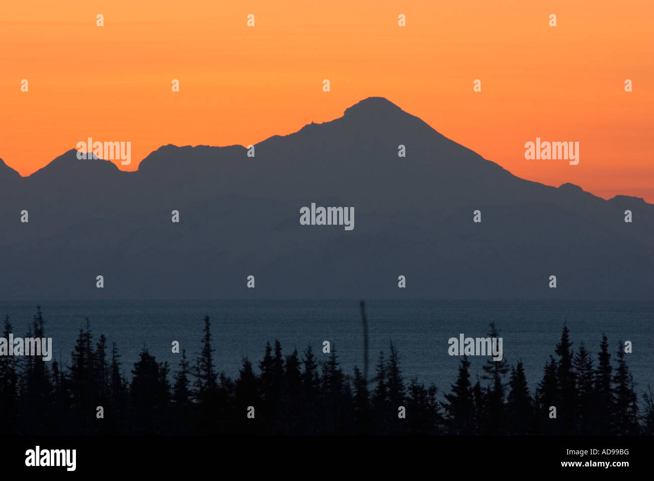 Sunset behind Iliamna Volcano Stock Photo - Alamy