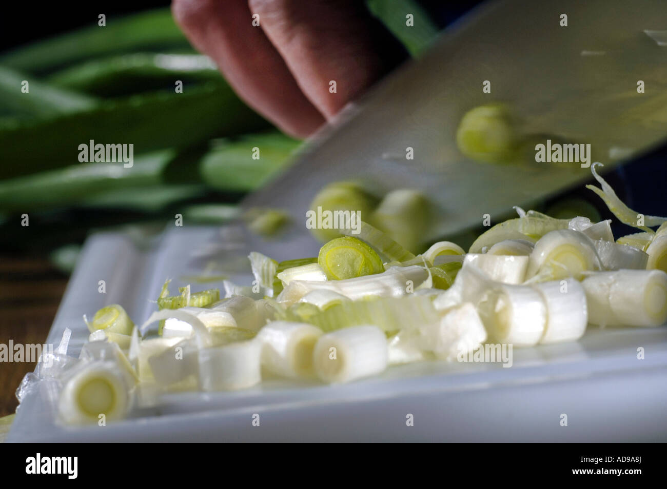 Chopping spring onions Stock Photo - Alamy