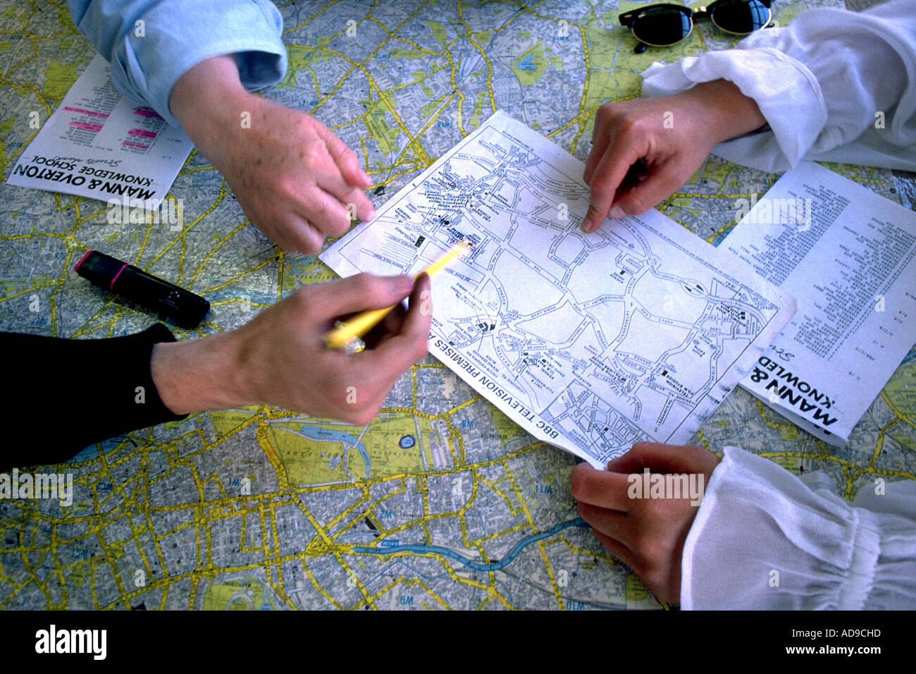 Men and women learning the Knowledge in a specialist knowledge school ...