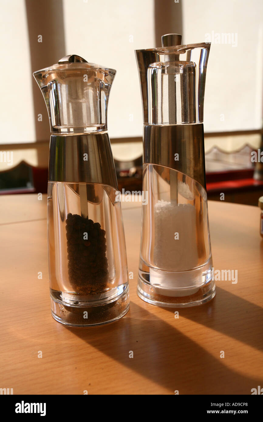 Modern glass and chrome salt and pepper pots Stock Photo - Alamy