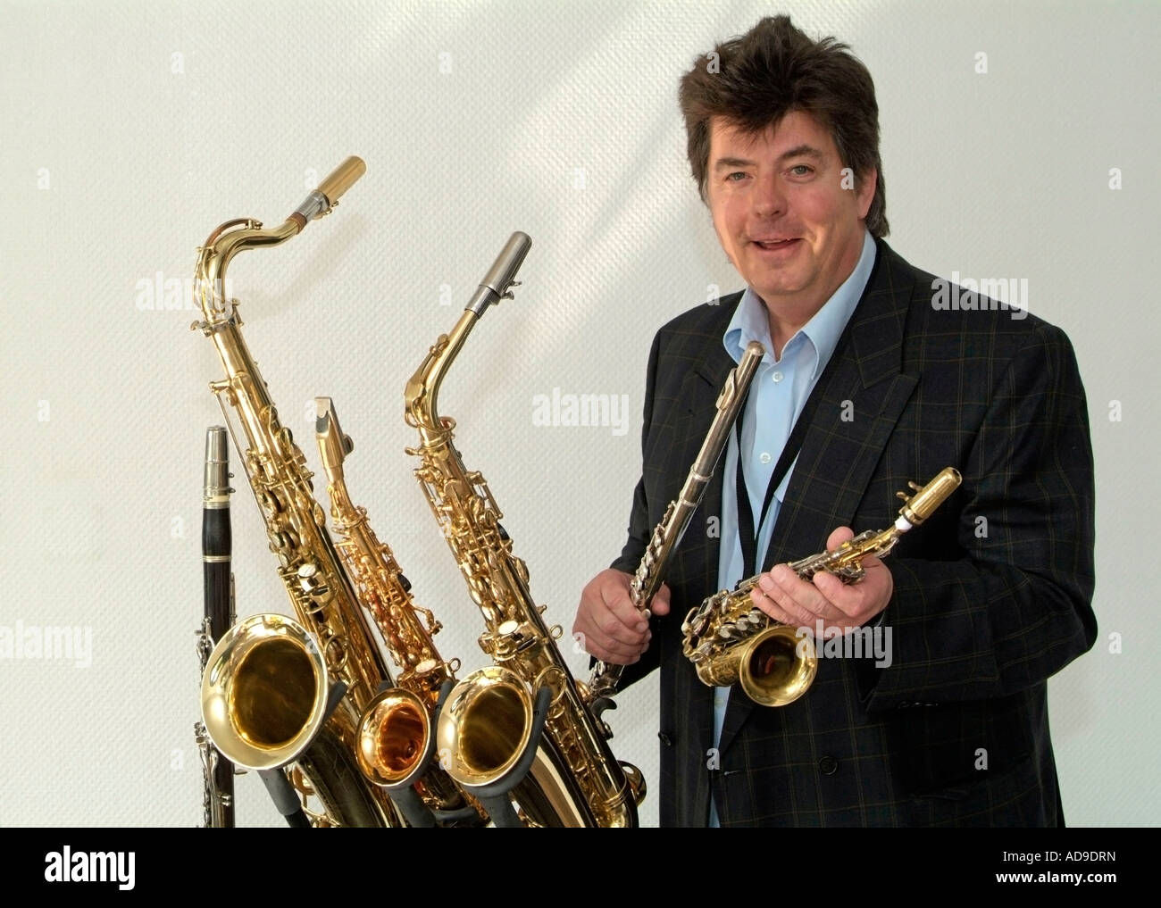musician showing different saxophones Stock Photo - Alamy