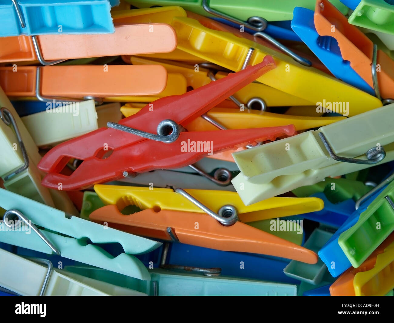 many coloured clothes pegs Stock Photo - Alamy