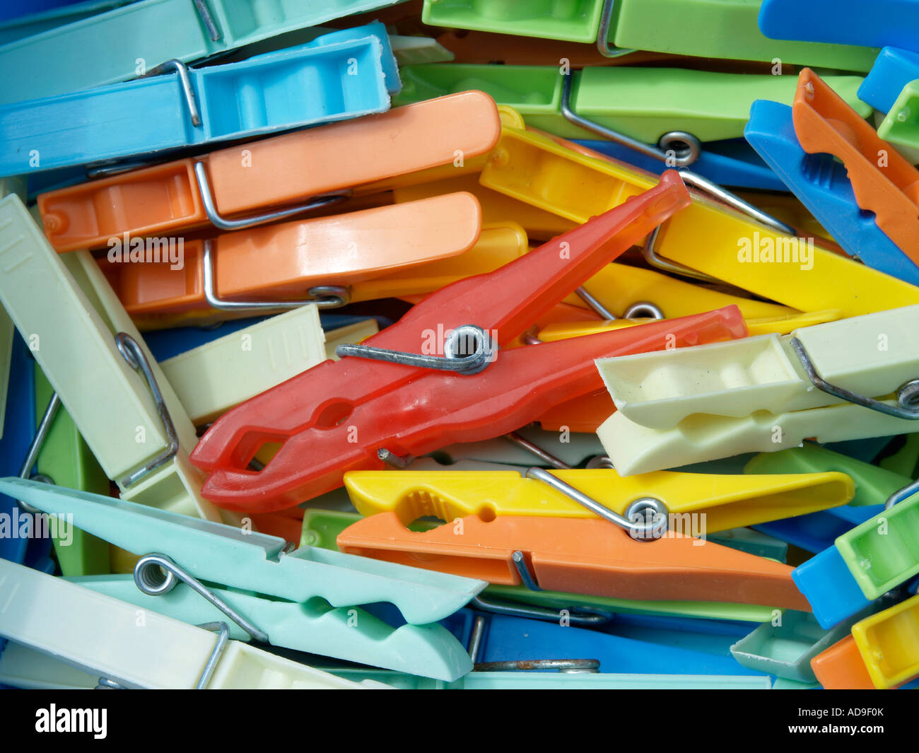many coloured clothes pegs Stock Photo - Alamy
