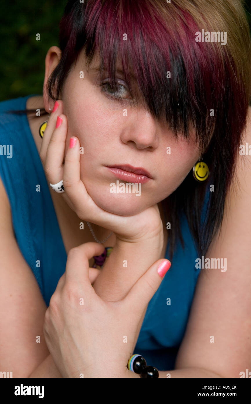 At the Botanical Gardens a woman with a melancholy expression on her ...