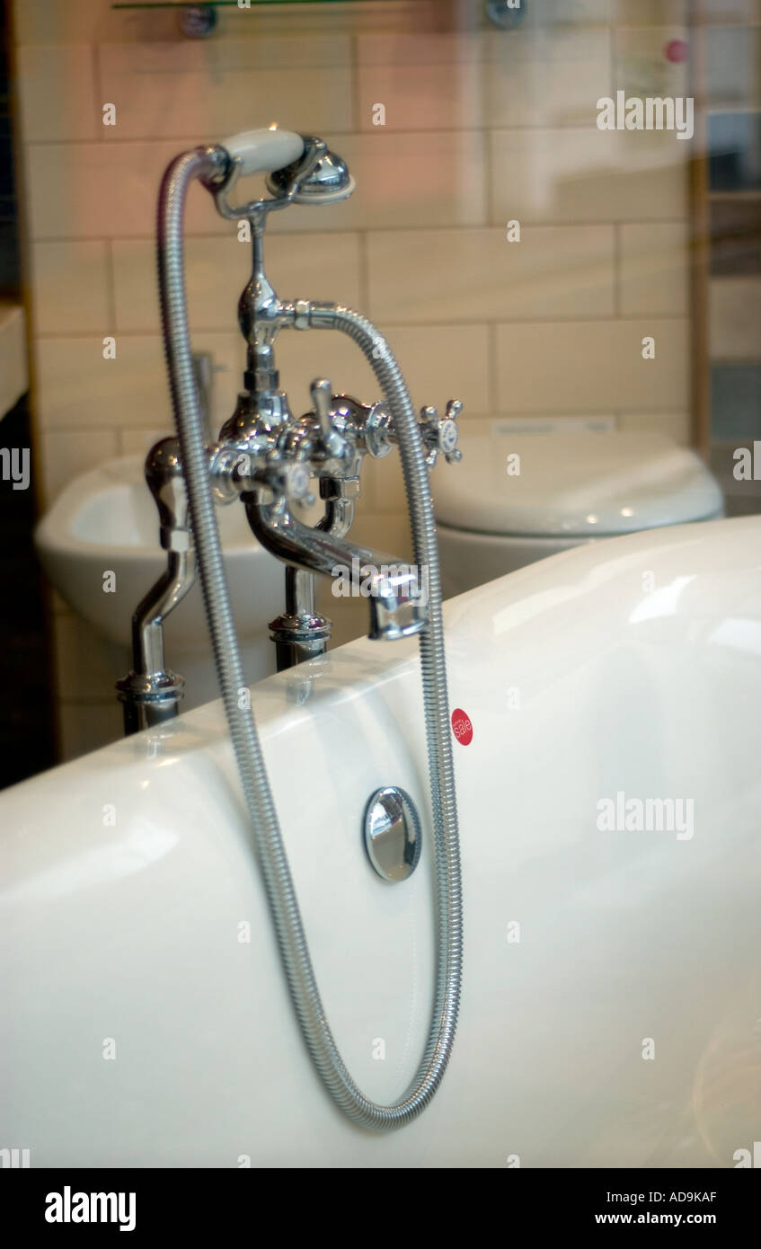 Antique style bathtaps in a window display Stock Photo - Alamy