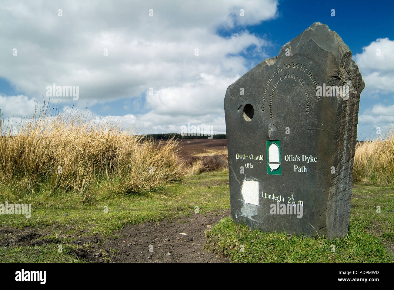 Slate marker and sign post on Offas Dyke footpath which extends along ...
