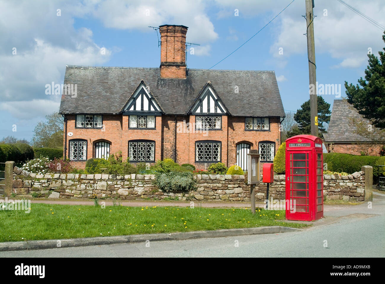 Traditional English phone box and post box in the Cheshire village of ...