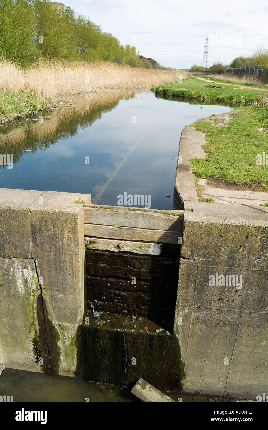 Barrier blocking the Sankey Canal, the first canal in the UK which ran from the River Mersey at ...