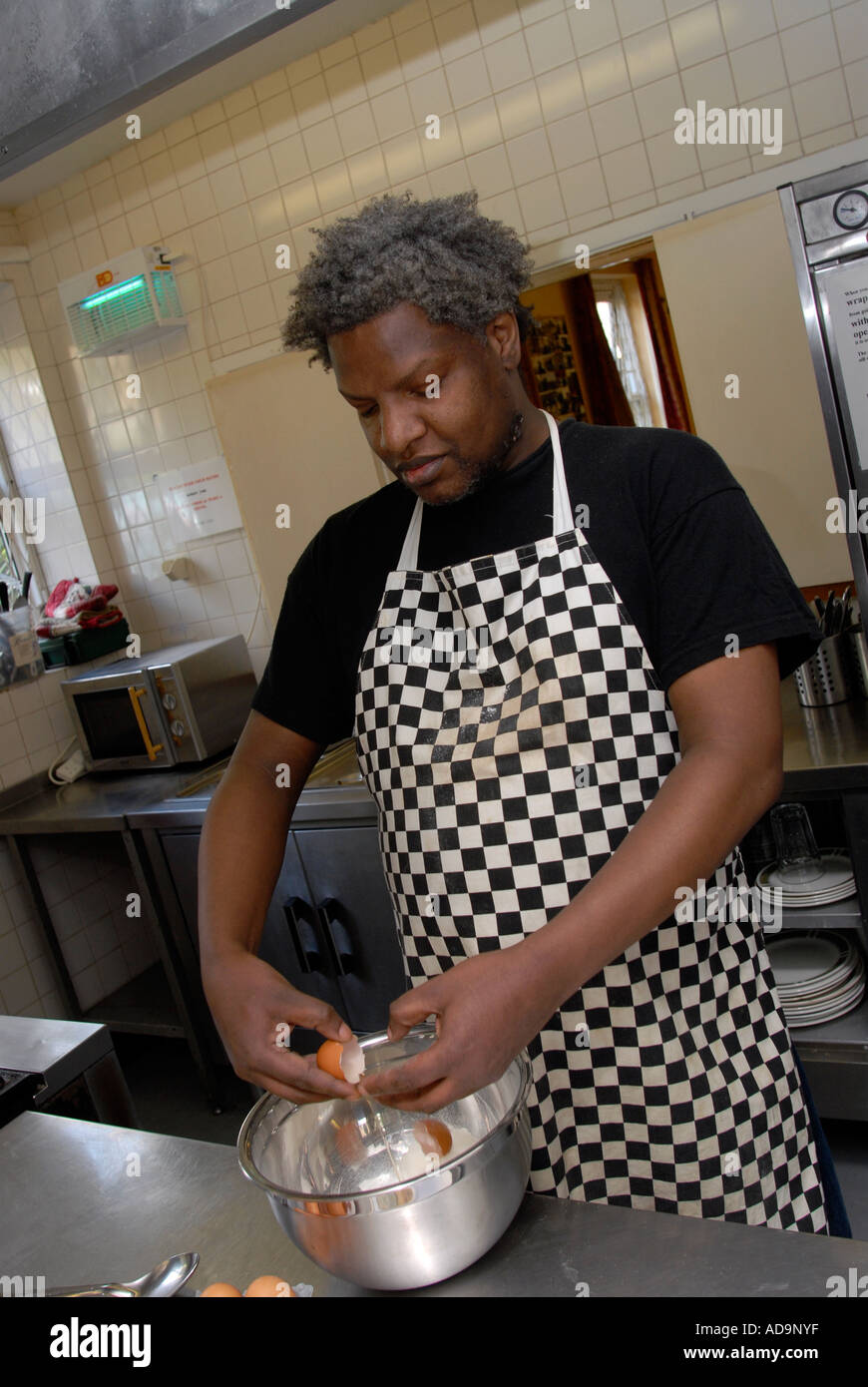 Mental health service user learning cooking skills at psychiatric ...