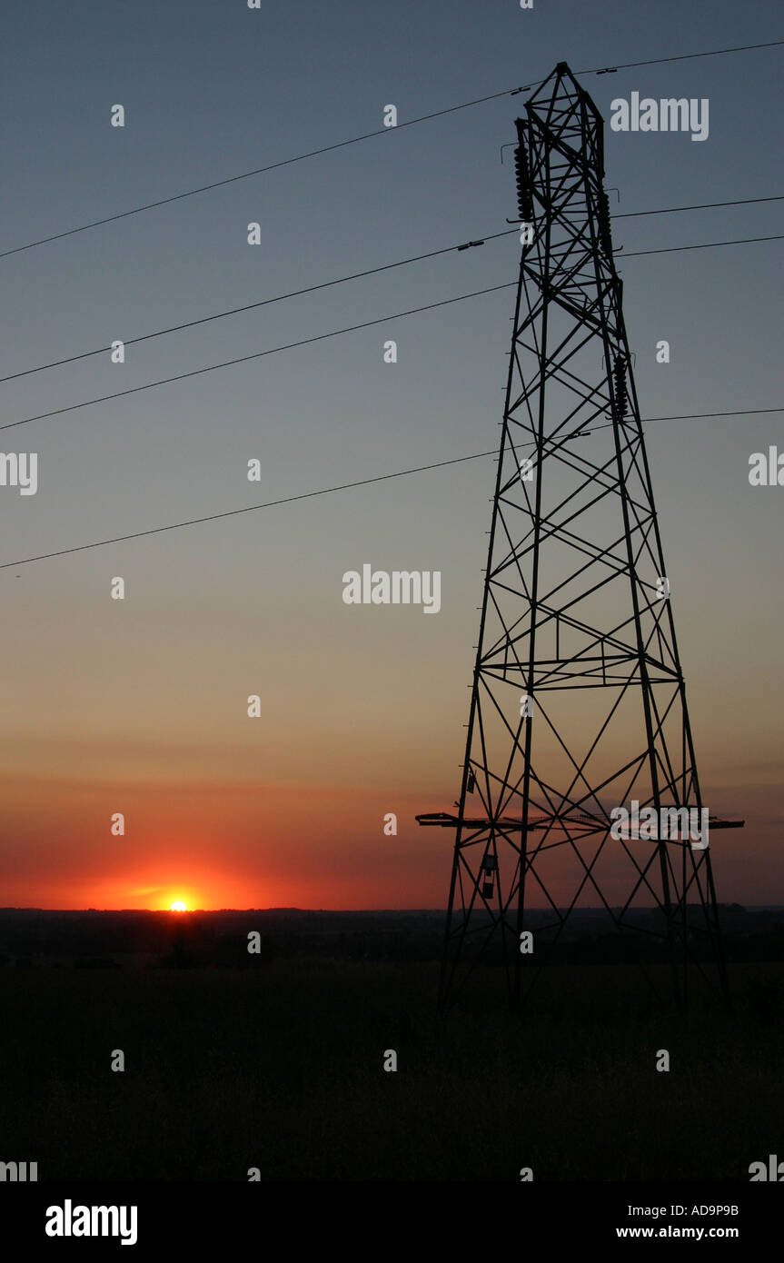 Sunset electricity pylon Stock Photo - Alamy