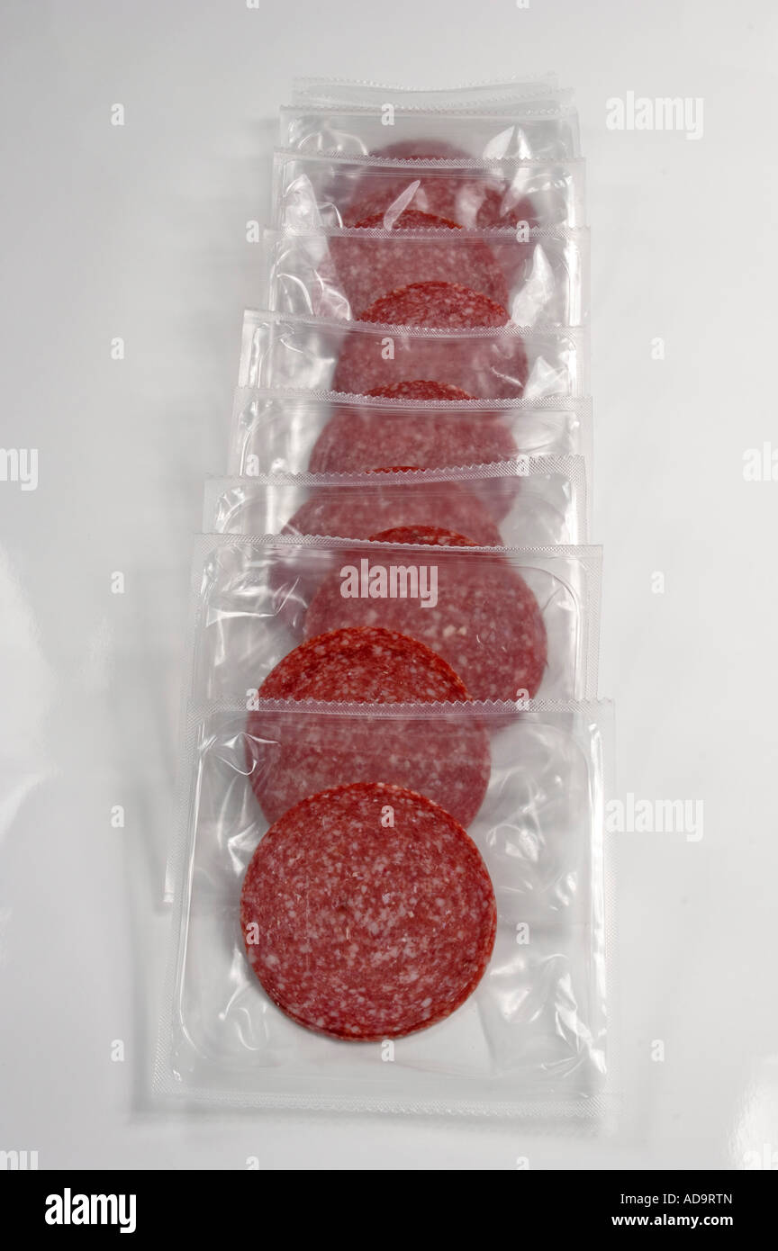 Plastic packs of sliced salami Stock Photo - Alamy