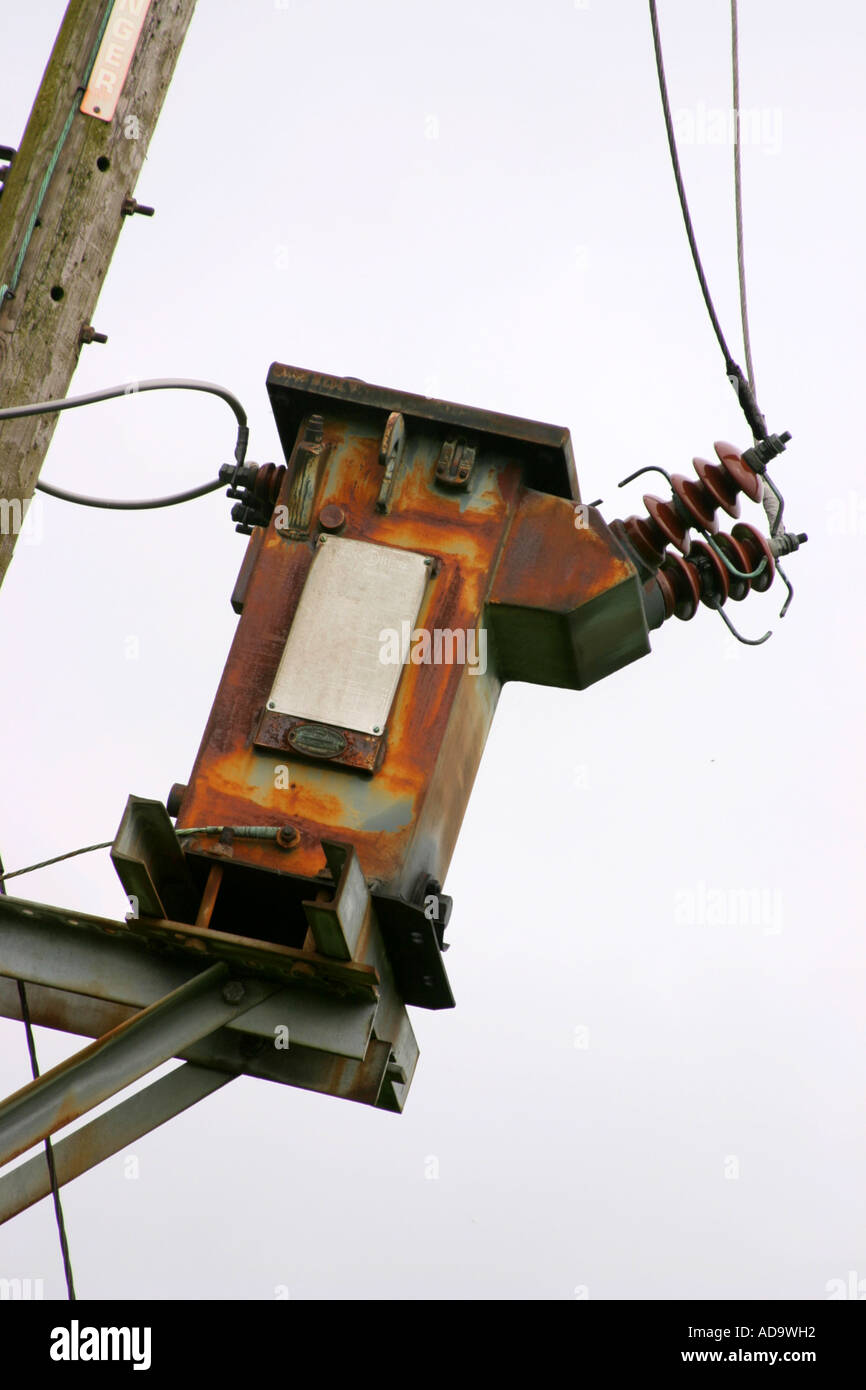 Rusty old electricity transformer on pole Stock Photo - Alamy