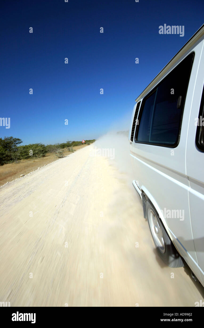 White minibus traveling down gravel road in Namibia Stock Photo - Alamy