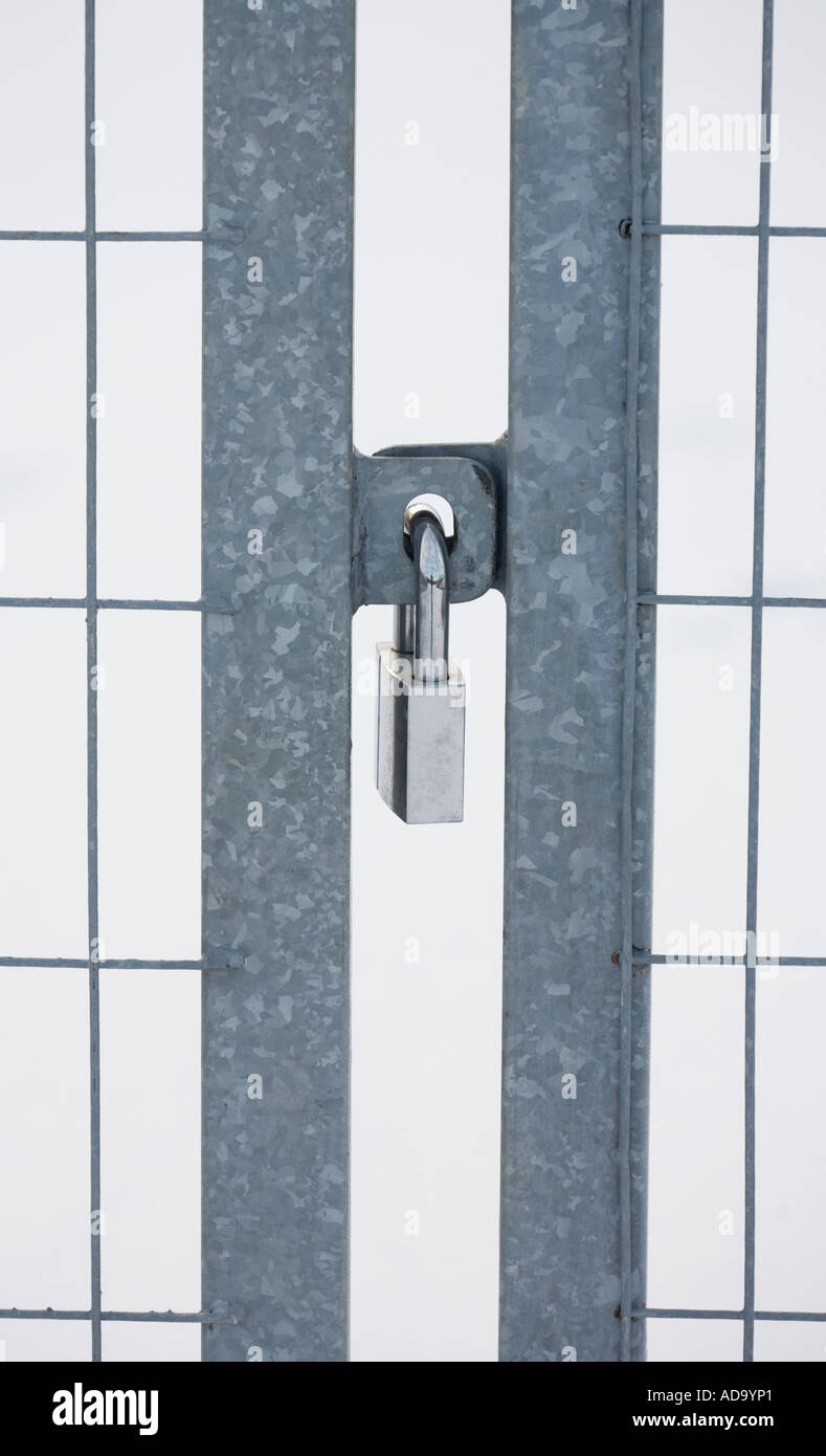 Closed Abloy padlock between metallic gate posts Stock Photo - Alamy