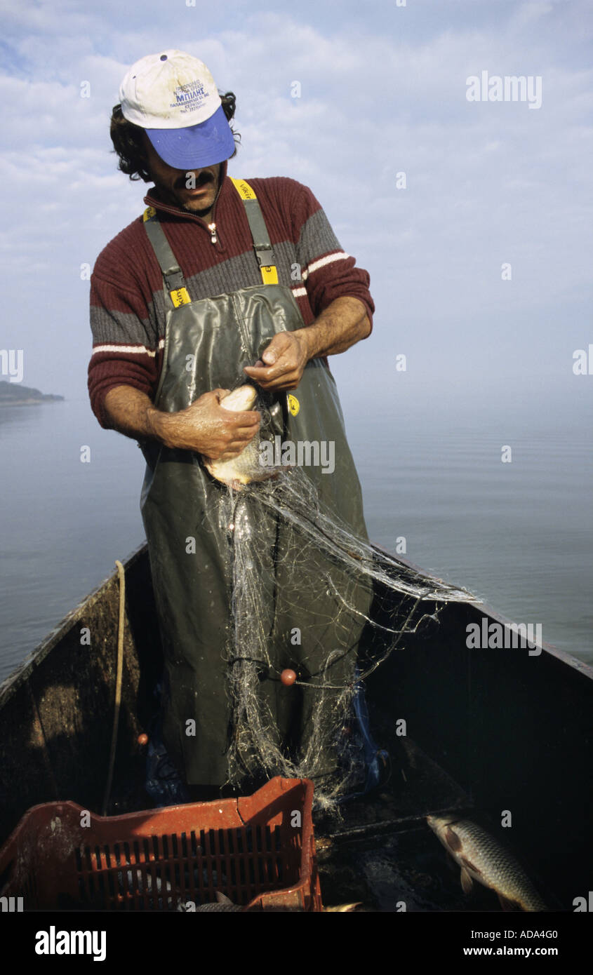 Fisherman at work, Greece Stock Photo - Alamy