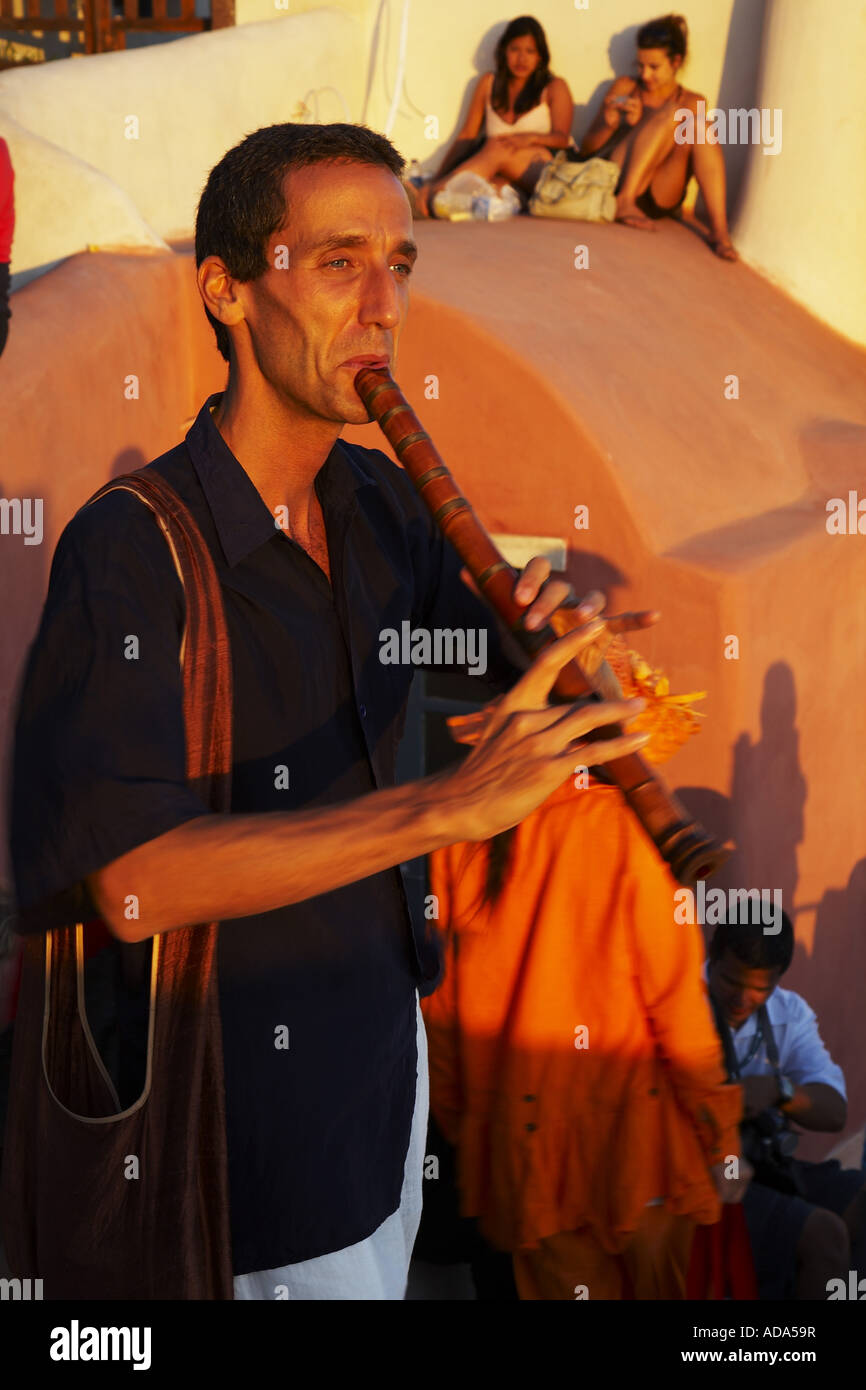 Old man playing flute in hi-res stock photography and images - Alamy