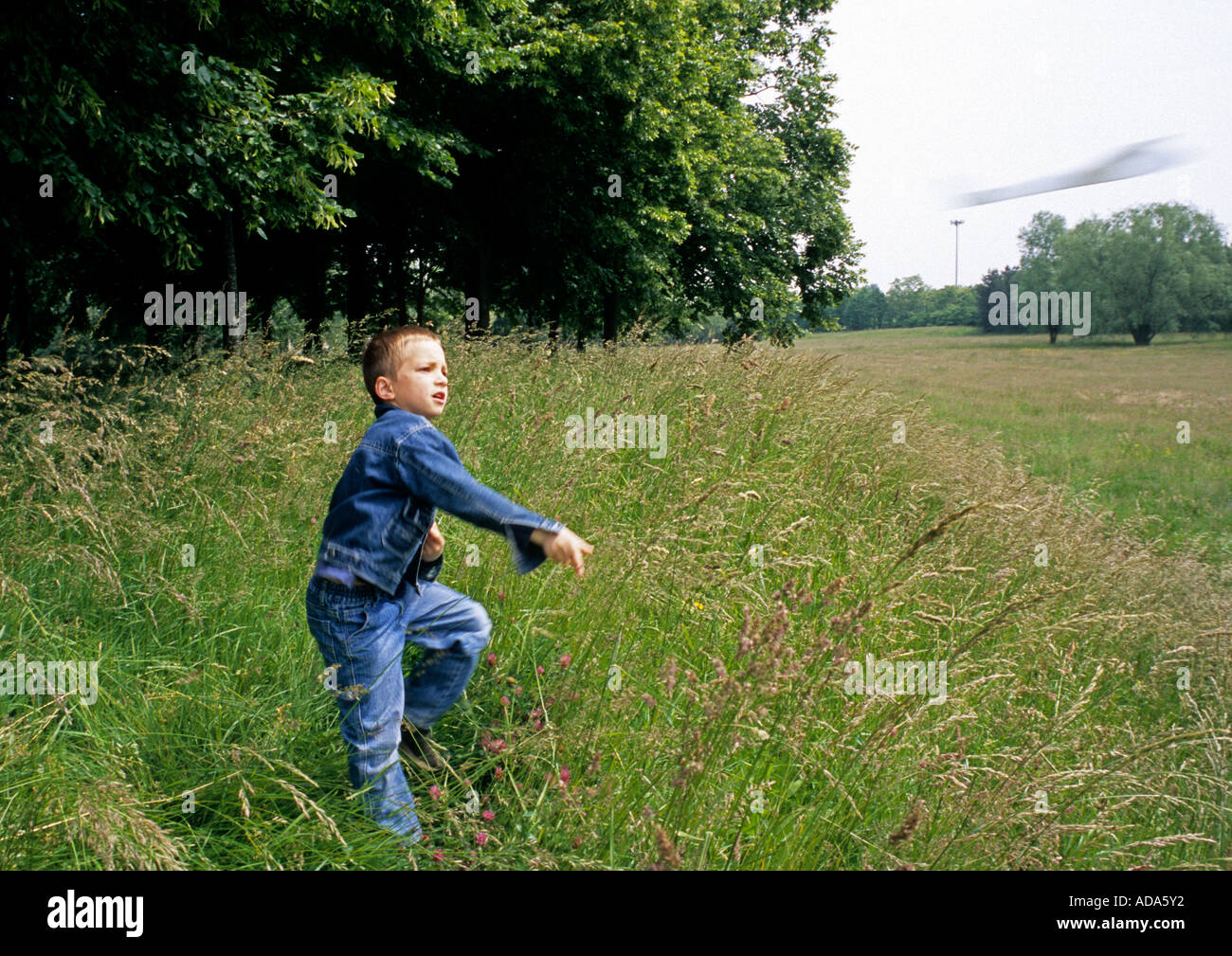 Boy making plane model take off Stock Photo - Alamy