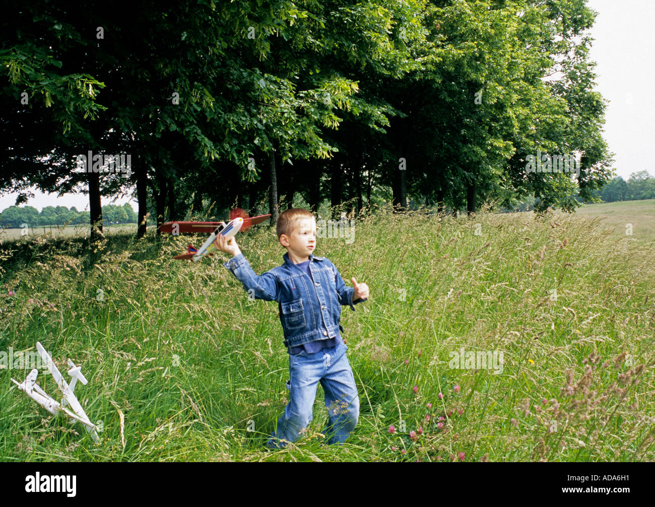 Boy making plane model take off Stock Photo - Alamy