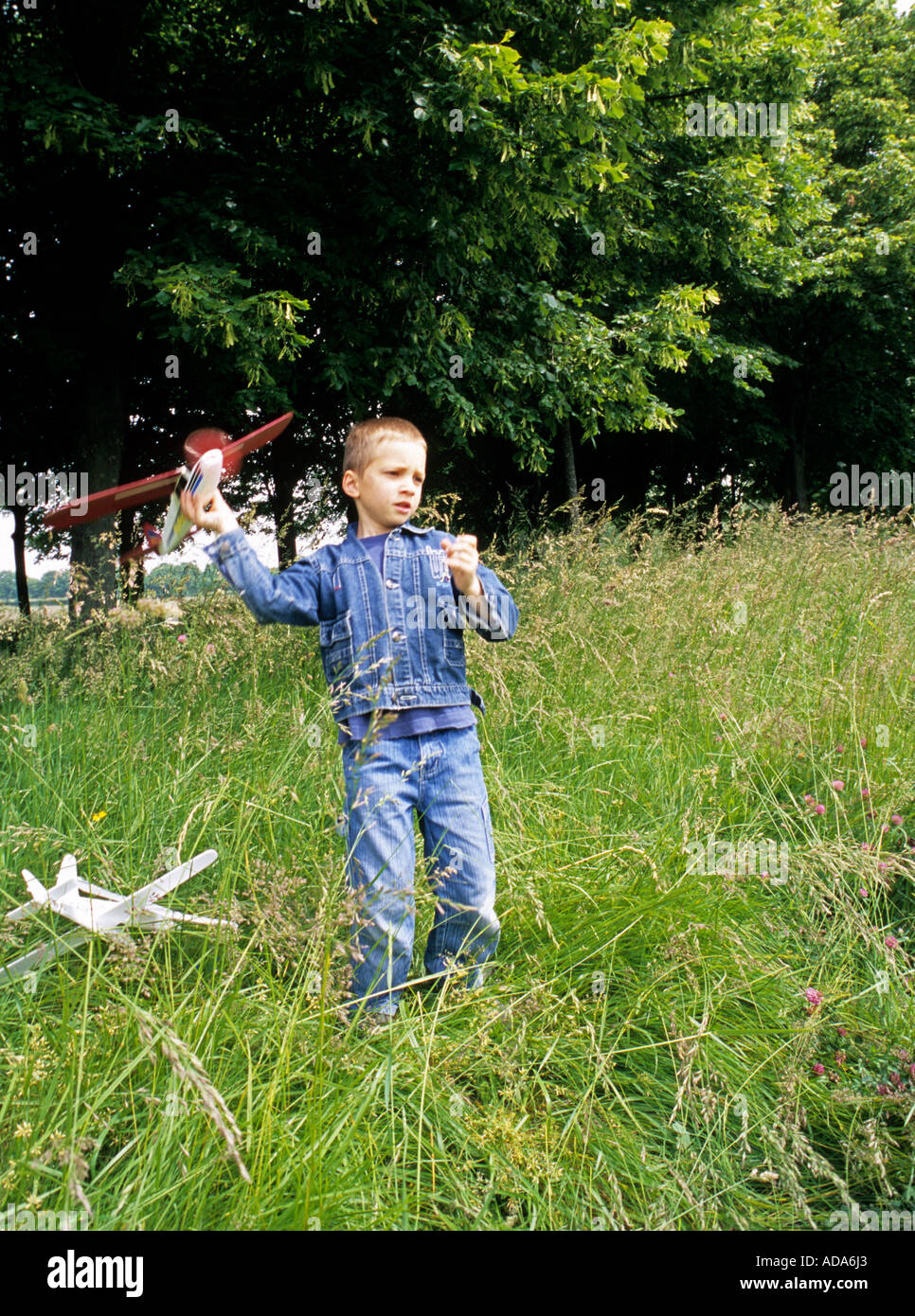 Boy making plane model take off Stock Photo - Alamy