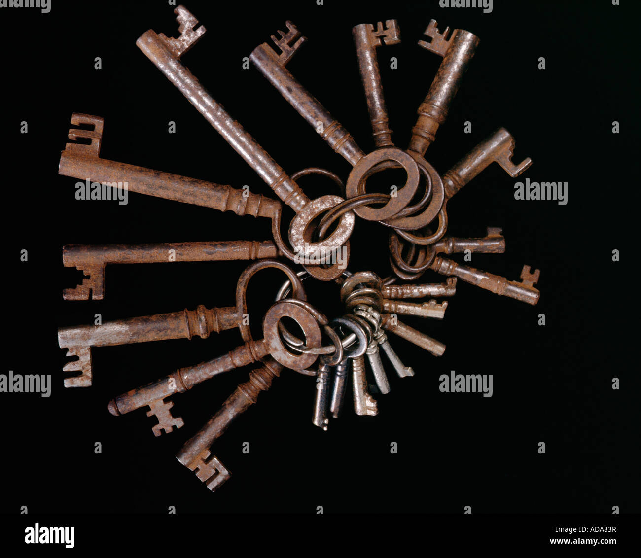 Rusted keys on black background Stock Photo - Alamy