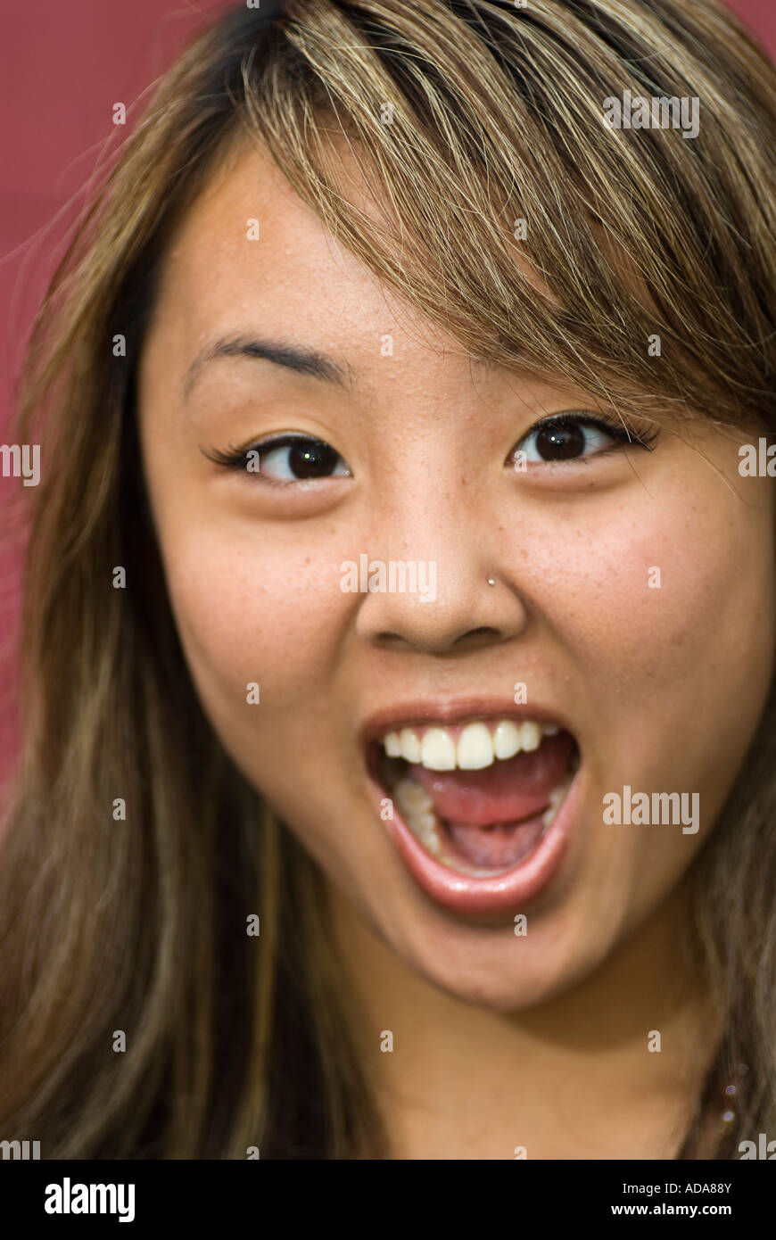 Headshot of a pretty young Asian woman Stock Photo - Alamy