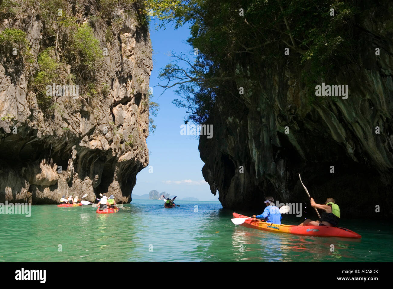 Tourists kayaking Ko Hong Island lagoon Phang Nga bay Krabi Thailand ...