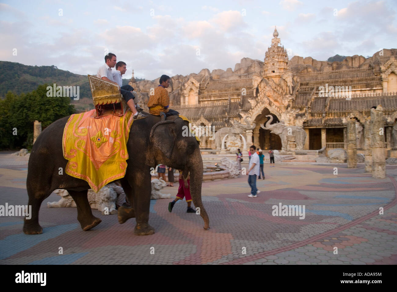 Tourists riding on a elephant Palace of the Elephants Phuket Fantasea ...