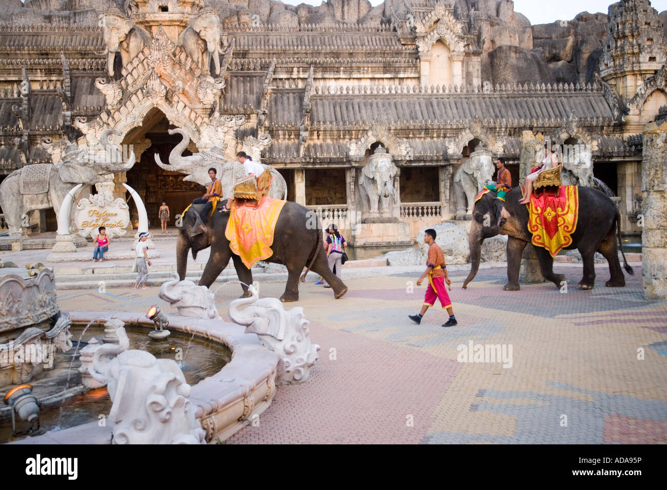 Tourists riding on a elephant Palace of the Elephants Phuket Fantasea ...
