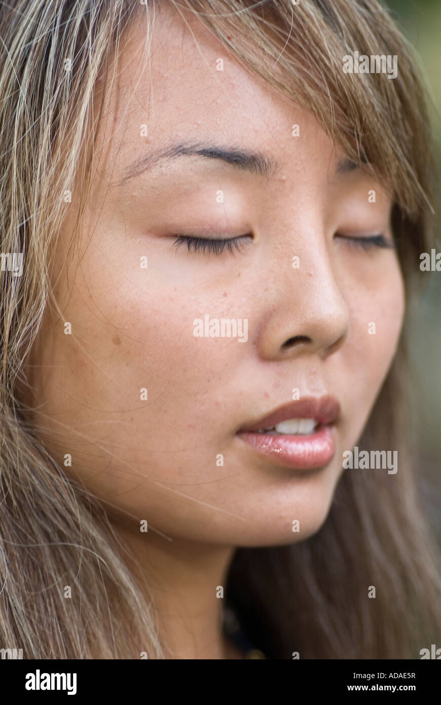 Headshot of a pretty young Asian woman Stock Photo - Alamy