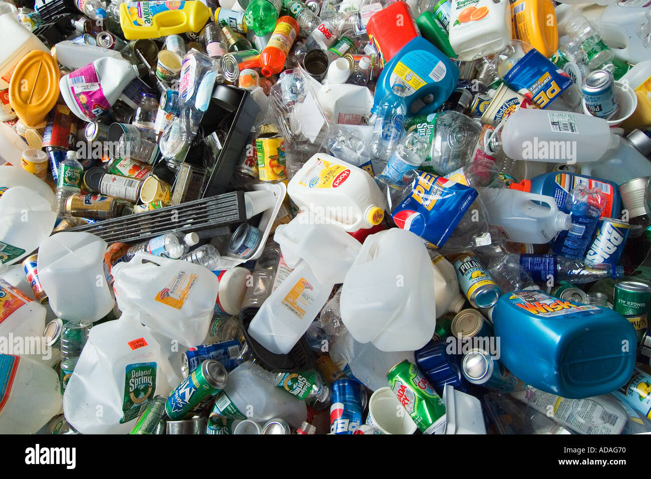 Mixed recyclable containers and materials await sorting at a recycling ...