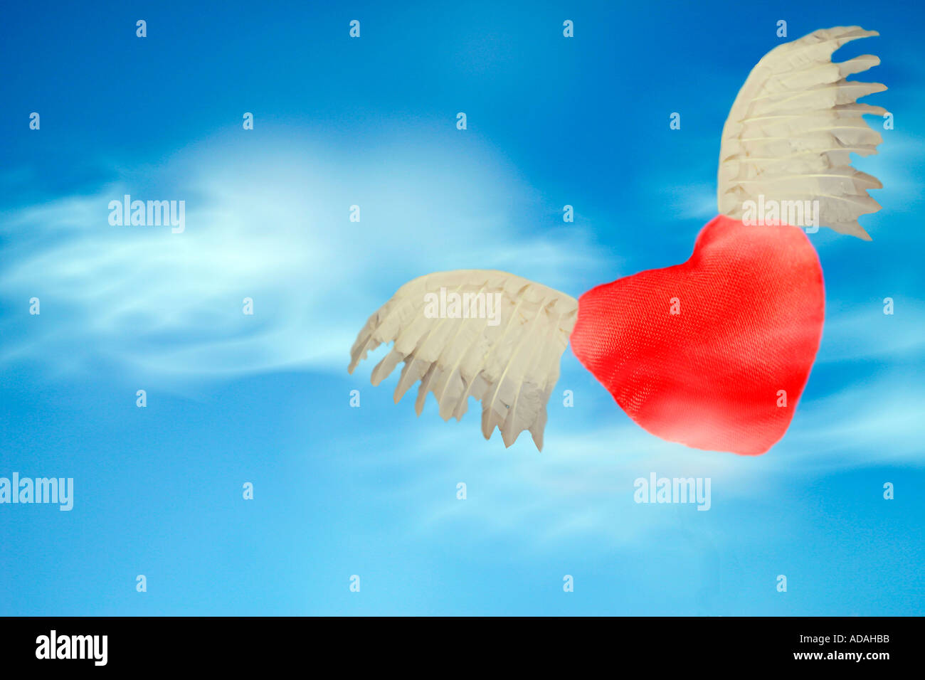 Symbol for Elusive Love Red Heart with Wings Stock Photo - Alamy