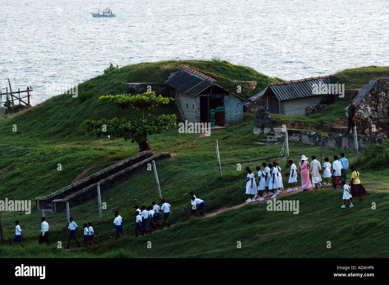 Galle Fort school children walking on the fortifications Stock Photo ...