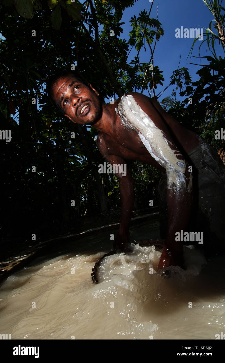 Kahawa miner washing the gem stones he collected in a mine Stock Photo ...