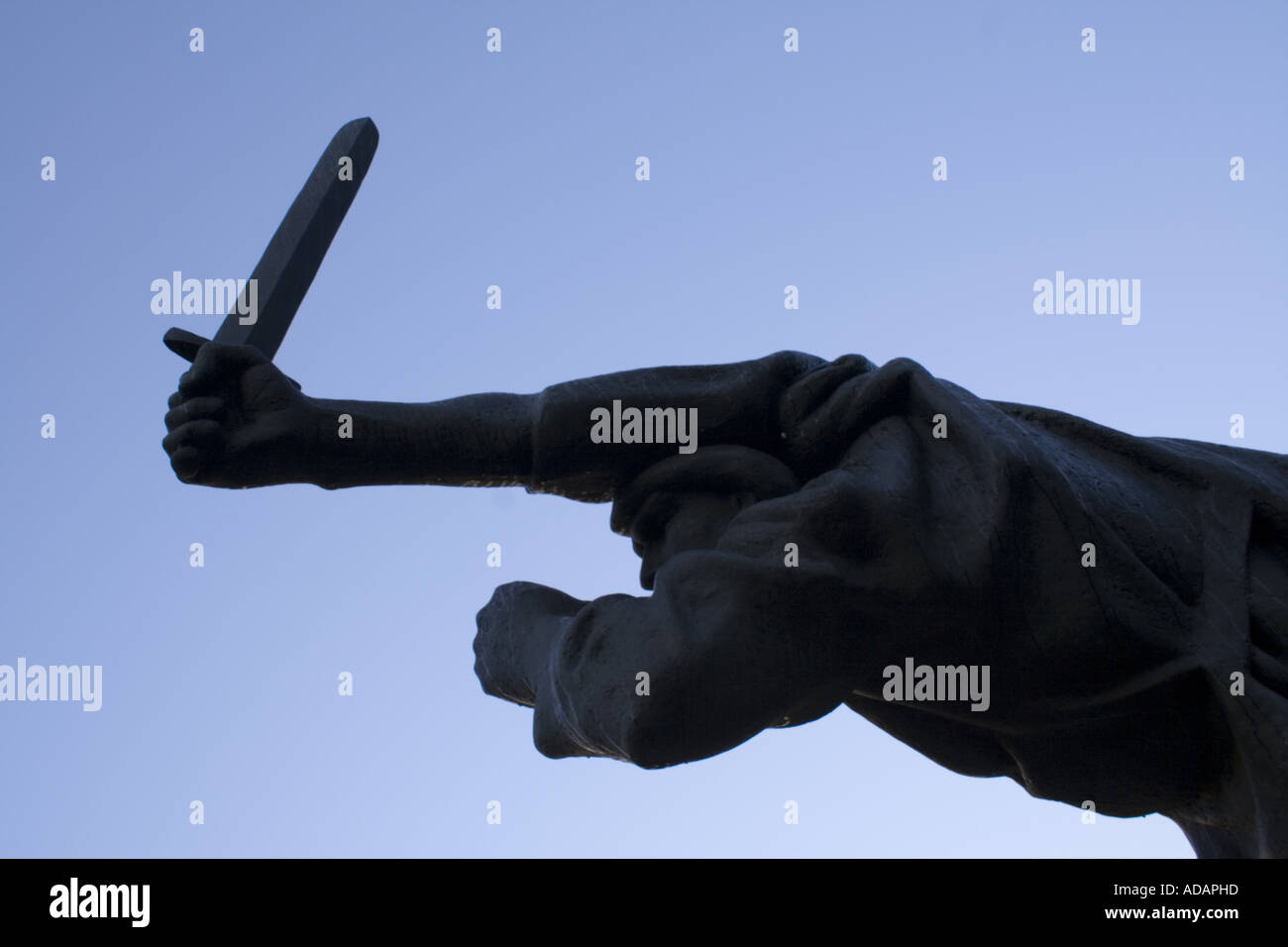 statue of a man with a sword in his hand storming forward Stock Photo ...