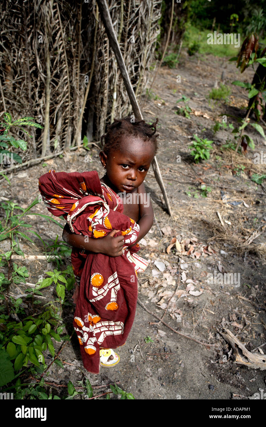 Vertical environmental portrait of Sierra Leonean baby outside ...