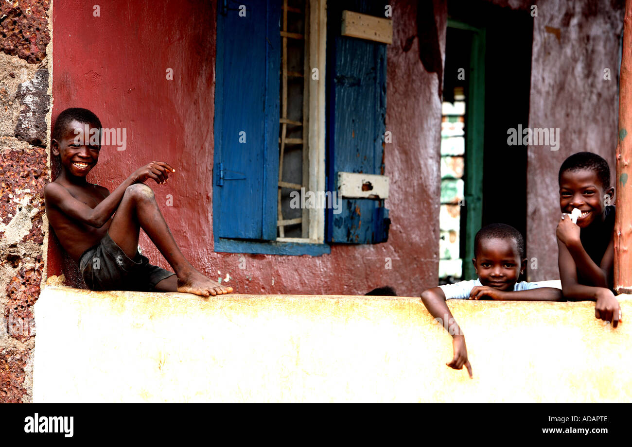 Vertical bright colour high contrast portrait of children in the street ...