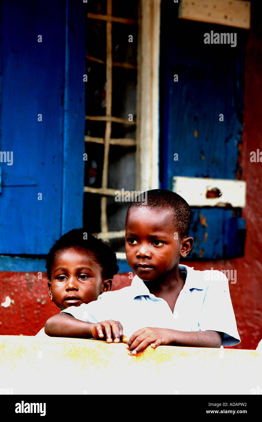 Vertical bright colour high contrast portrait of children in the street ...